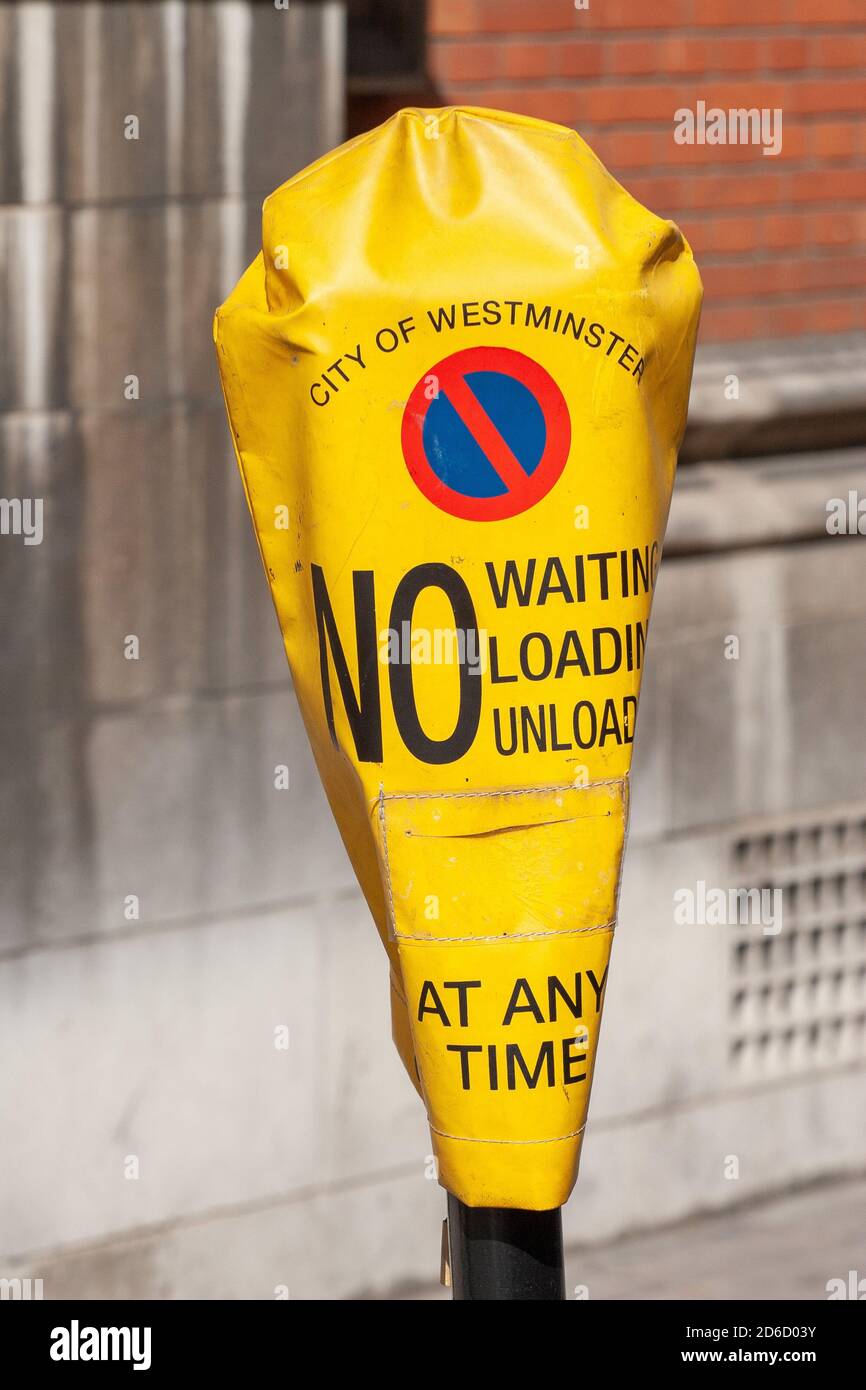 Westminster parking meter covered with a yellow bag indicating that it ...