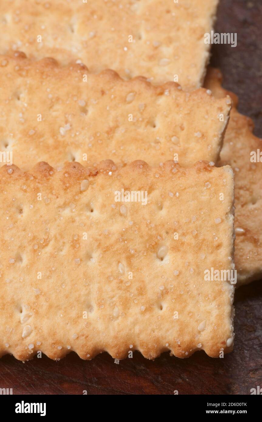 French crackers on a wooden board, macro shot Stock Photo - Alamy