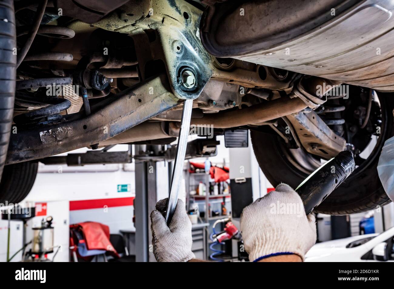 Car mechanic checks chassis or wheels alignment on Service station ...