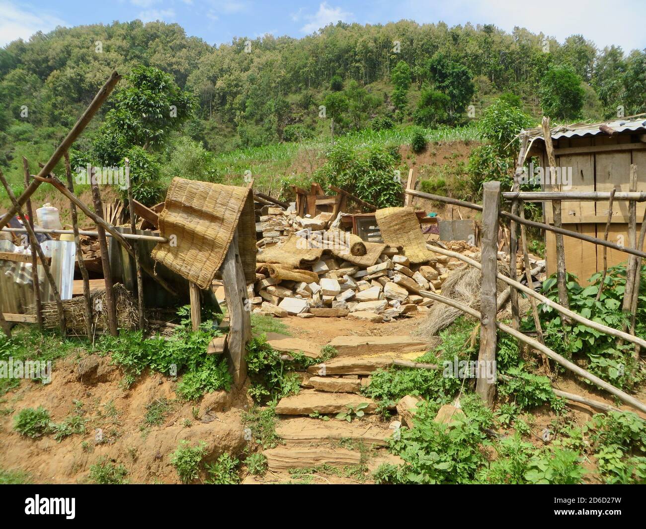 Grassy landscape view with broken stone rubble of an ancient ruined ...