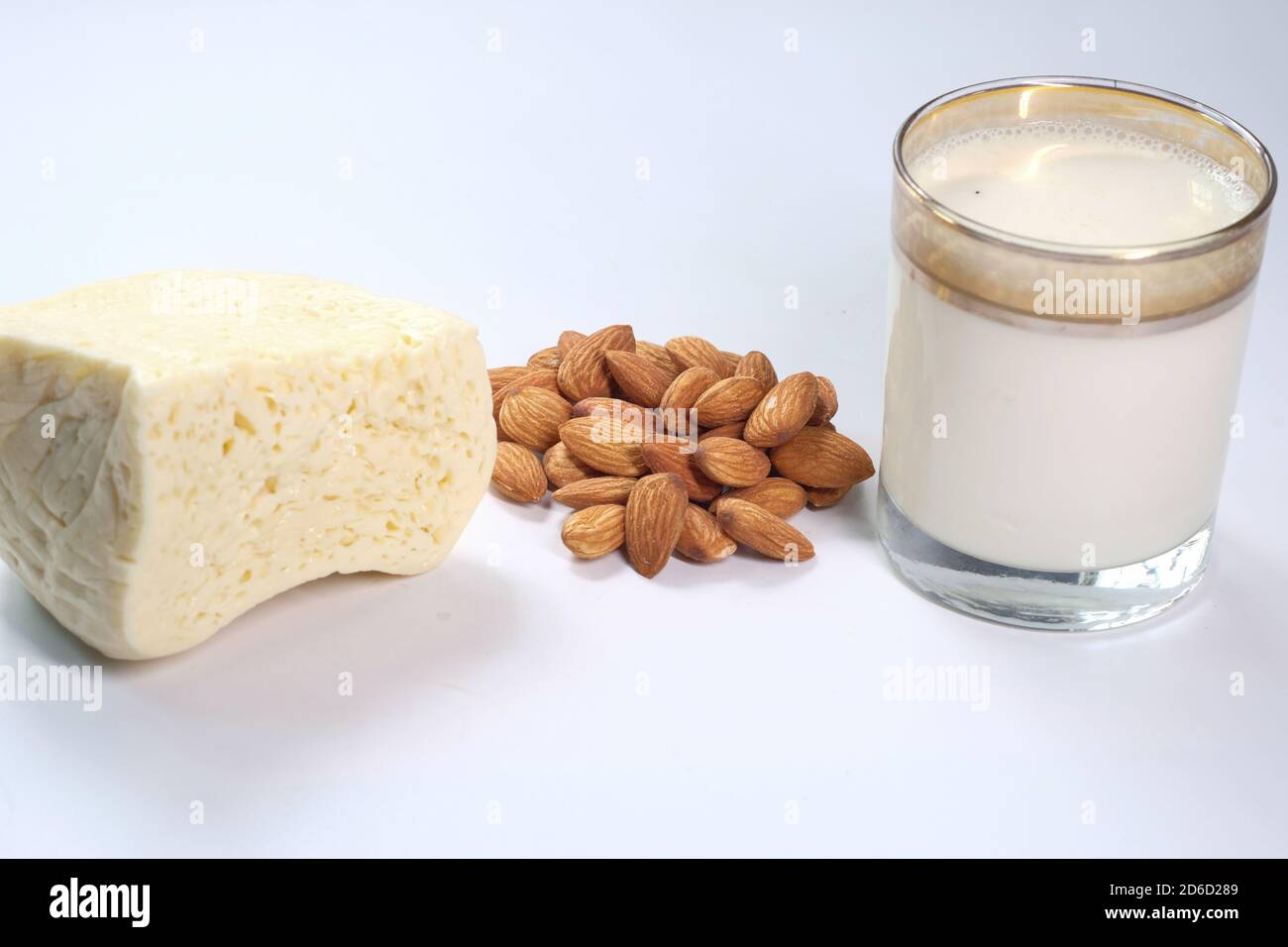 almond nut, cheese and milk on white background Stock Photo - Alamy