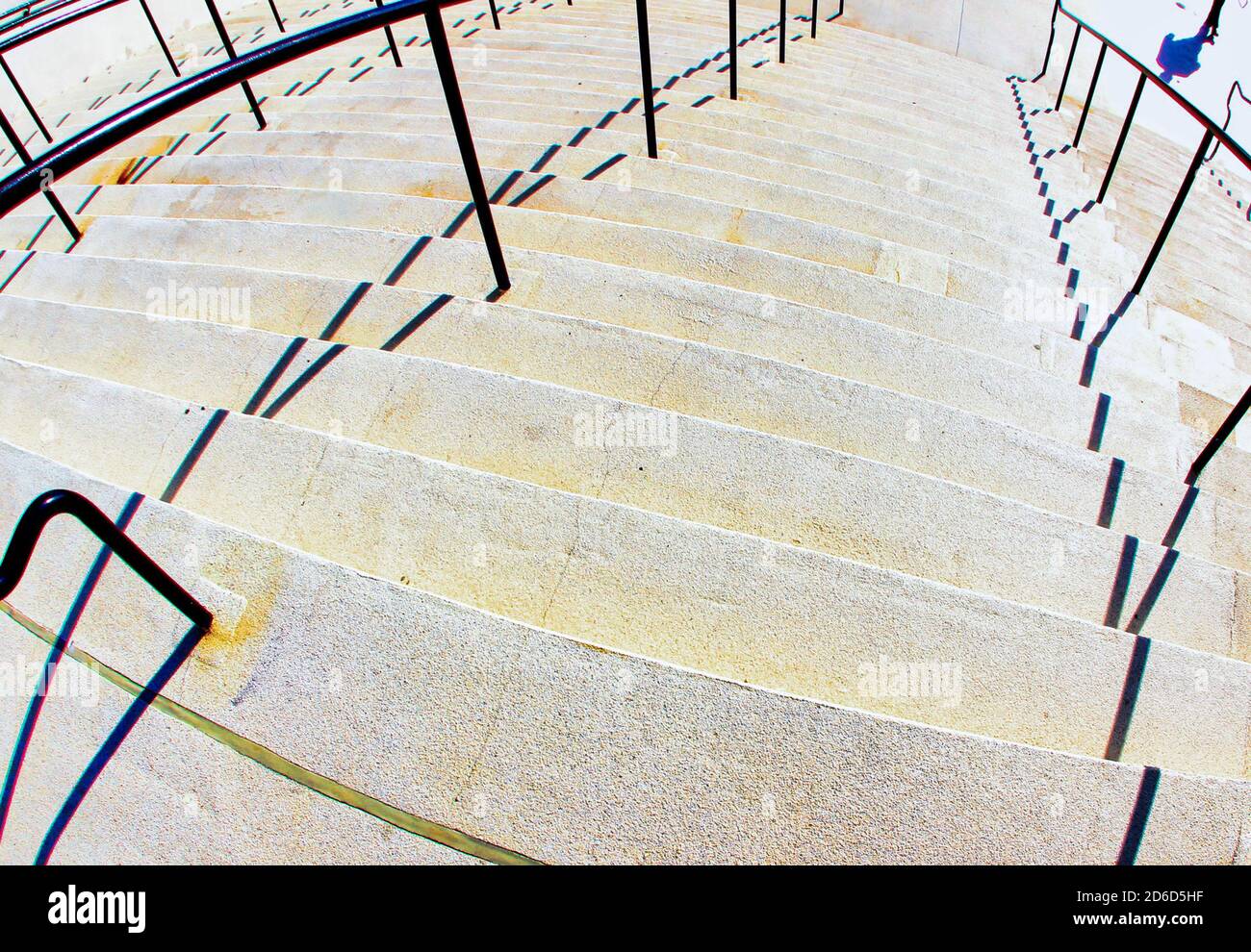 Looking down on long curving concrete steps Stock Photo - Alamy