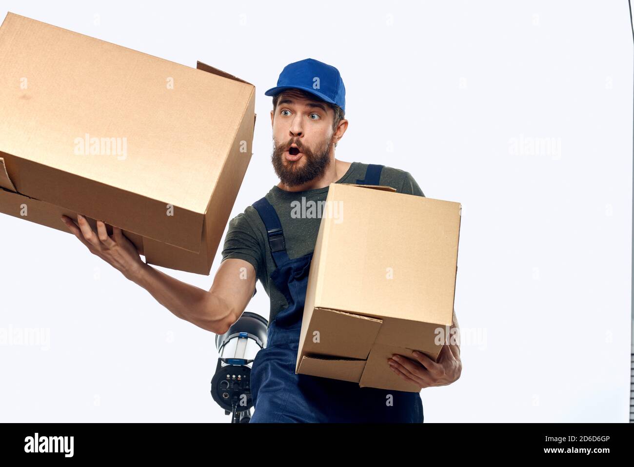 Working man with boxes in hands delivery service work lifestyle Stock ...