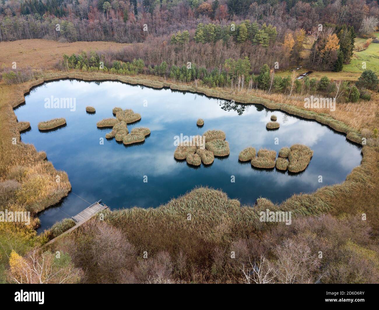 Aerial image of a pond with floating mats, which were cut of from peat ...