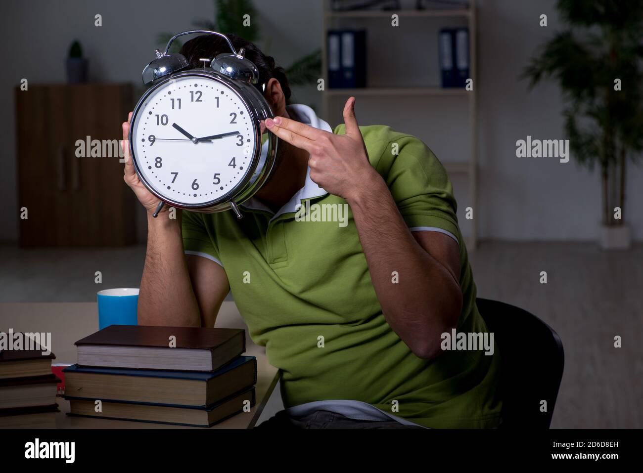 Young student studying at night at the home Stock Photo - Alamy