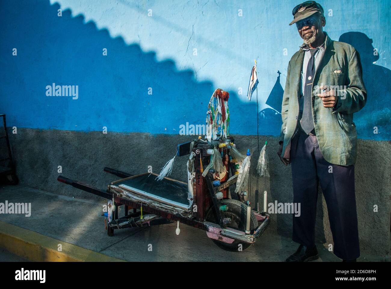 An old Cuban man with his trolly working at the bus station in Santiago ...