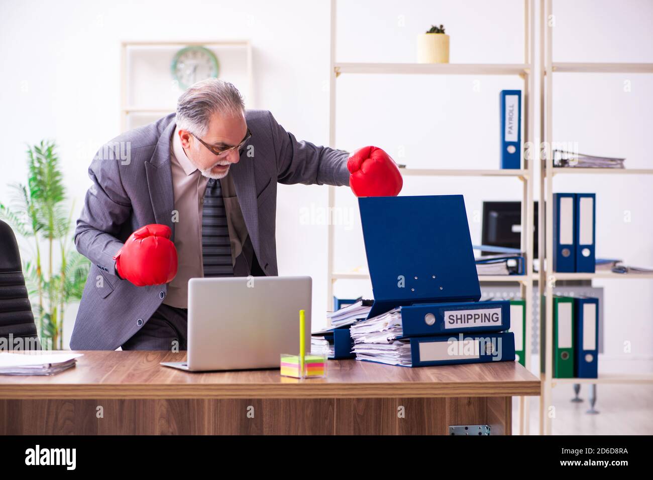 Businessman angry and furious at his workplace Stock Photo - Alamy