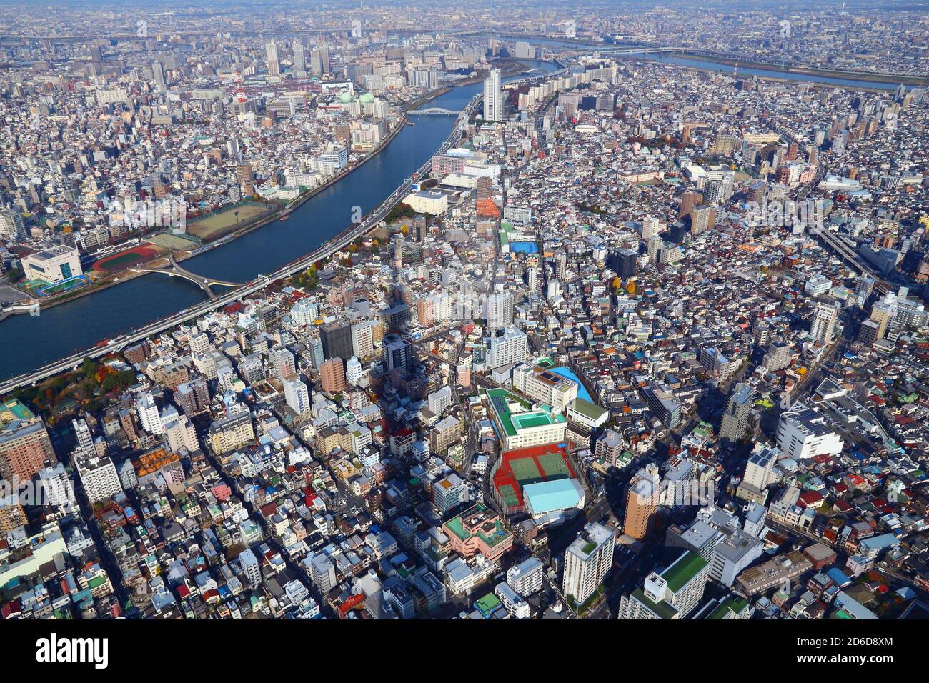 Tokyo city aerial view with shadow of a tall building. Sumida river ...