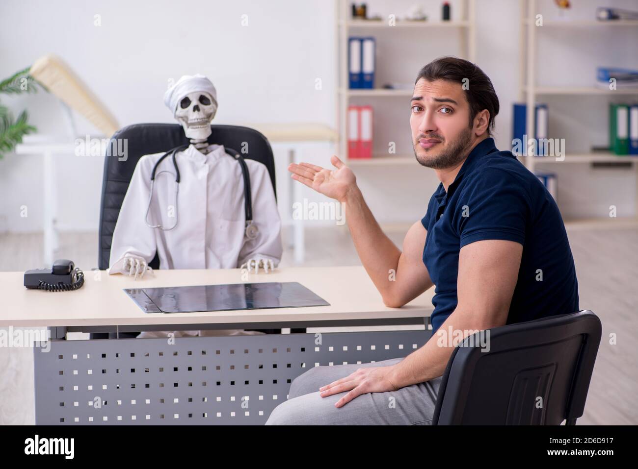 Young man visiting dead doctor in hospital Stock Photo - Alamy