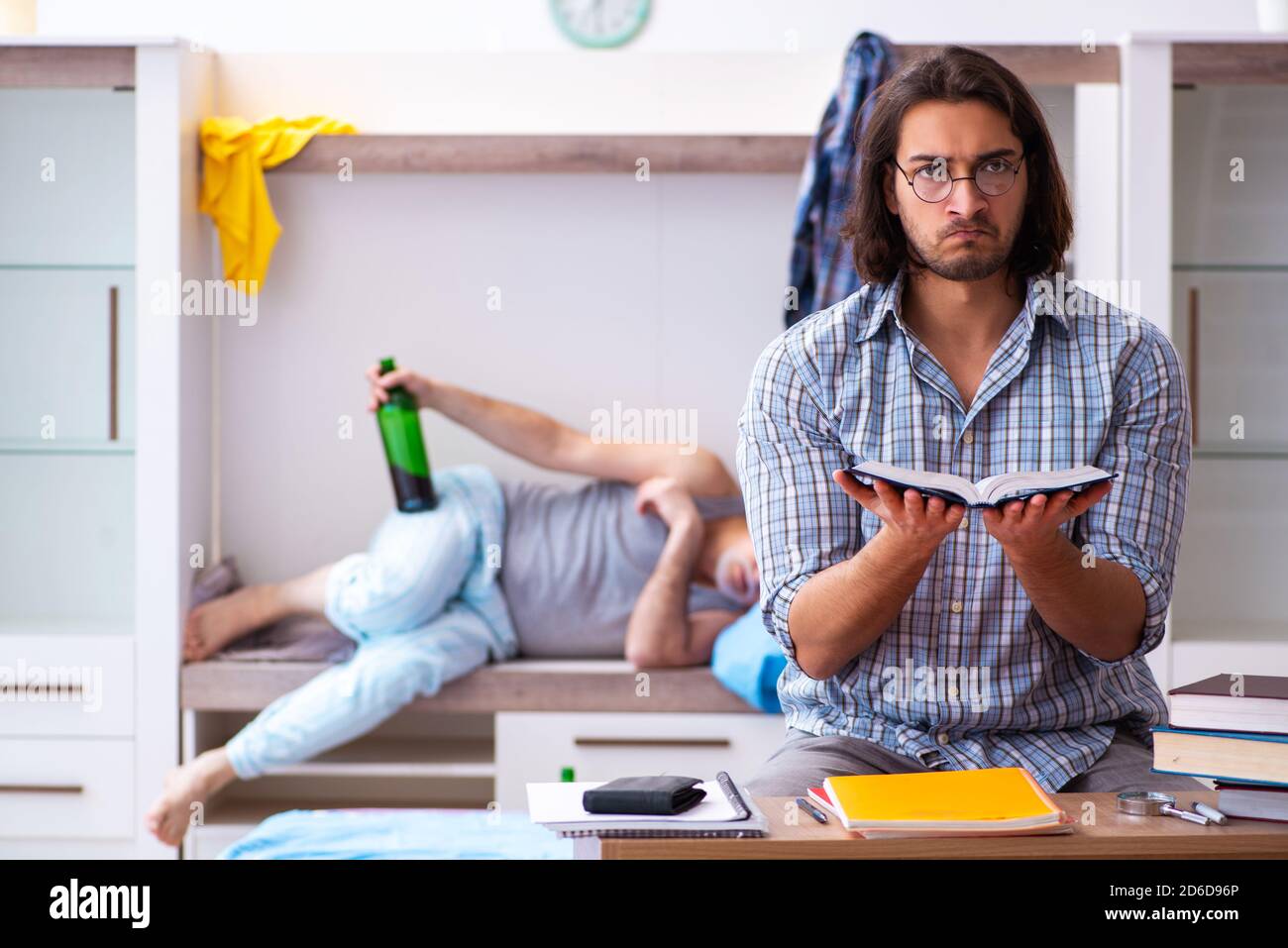 Young son student and dad alcoholic at home Stock Photo - Alamy