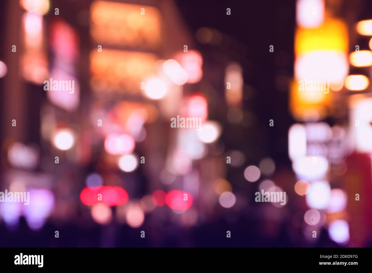 Abstract city lights background. Blurred defocused night neons in Tokyo ...