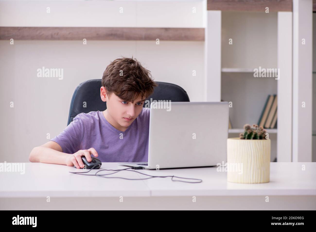Boy playing computer games at home Stock Photo - Alamy