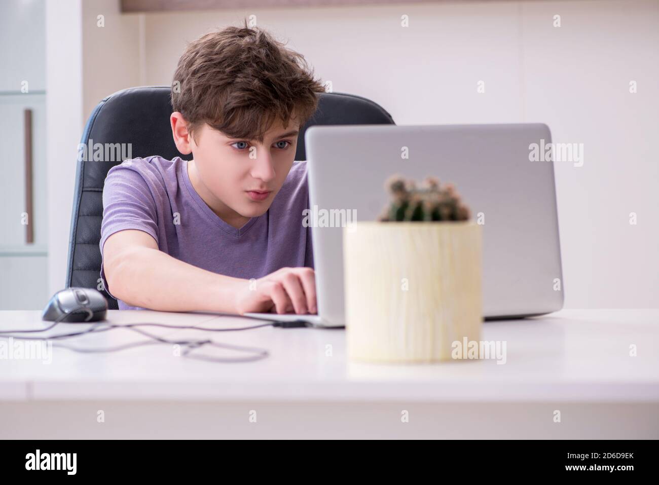 Boy playing computer games at home Stock Photo - Alamy