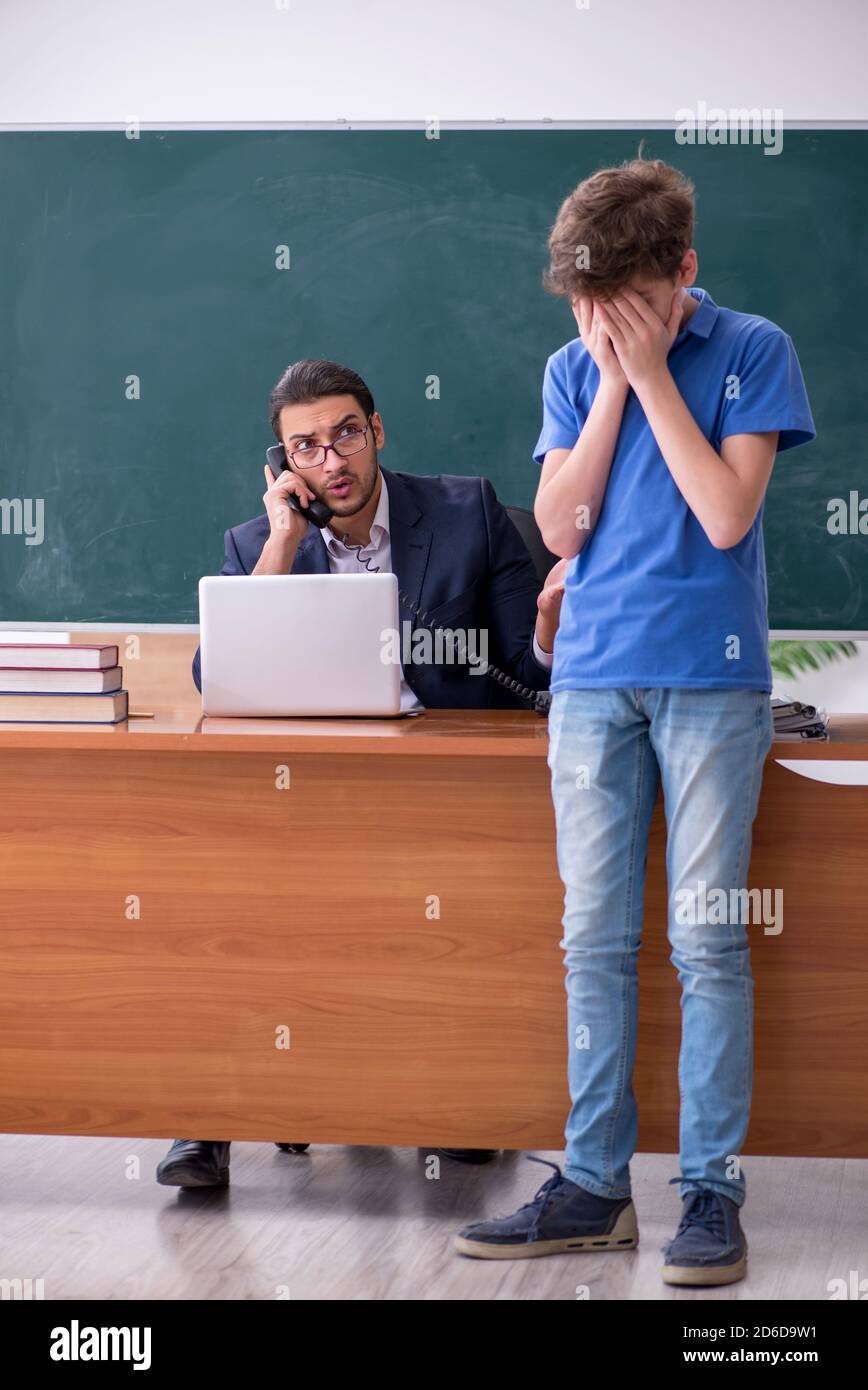Kid crying teacher hi-res stock photography and images - Alamy