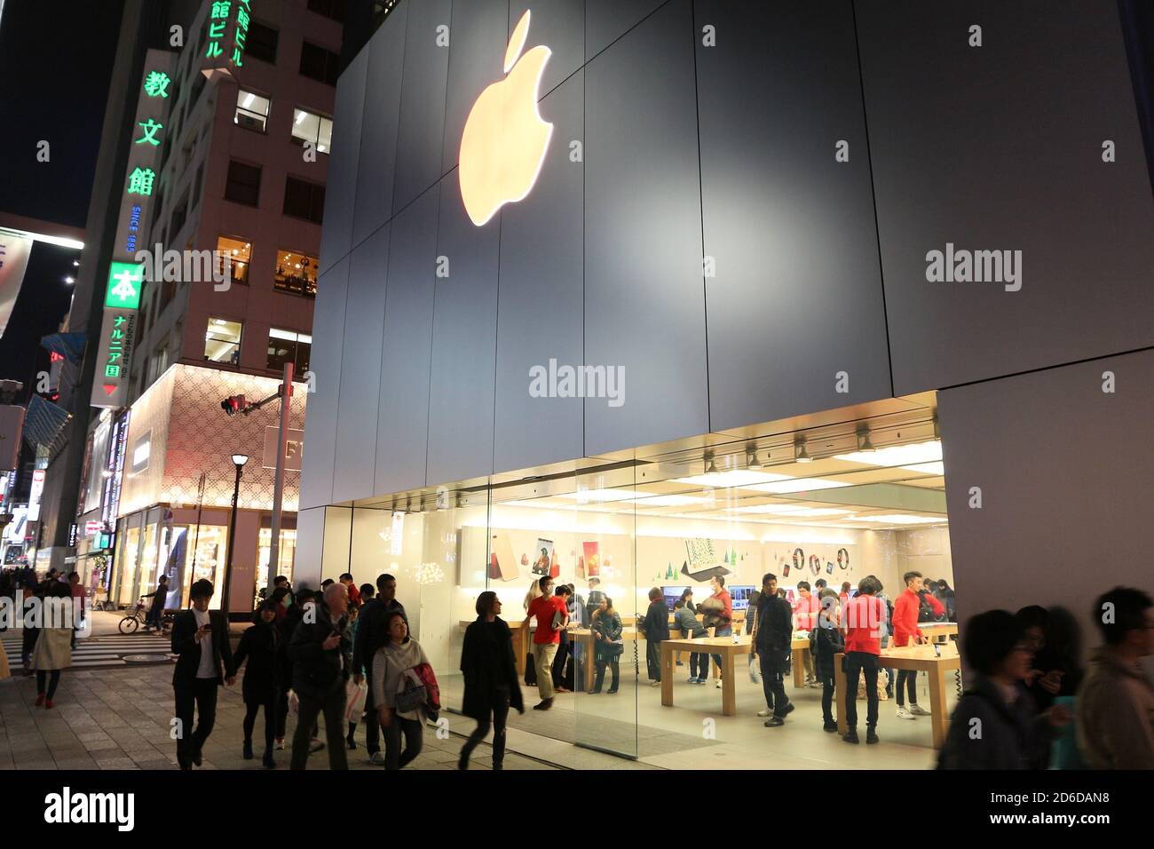 TOKYO, JAPAN - DECEMBER 4, 2016: People walk by Apple tech store in ...