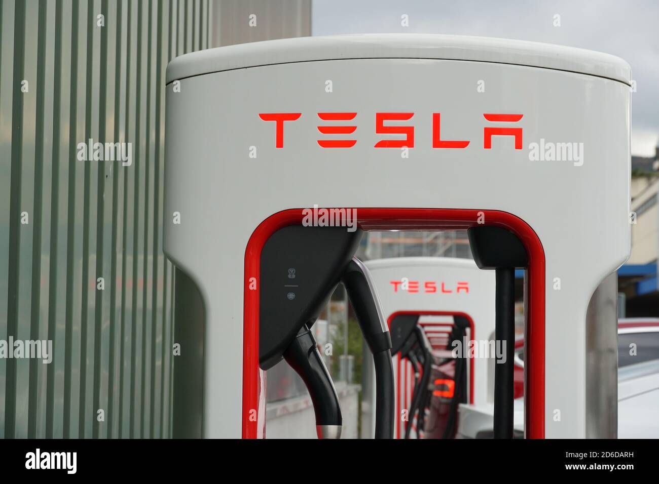 Front view of Tesla electric charging stations arranged in a row. They ...