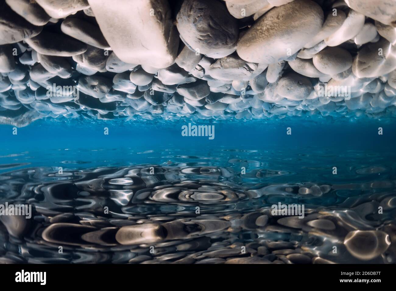Underwater sea with stones, reflection and blue water. Ocean texture ...
