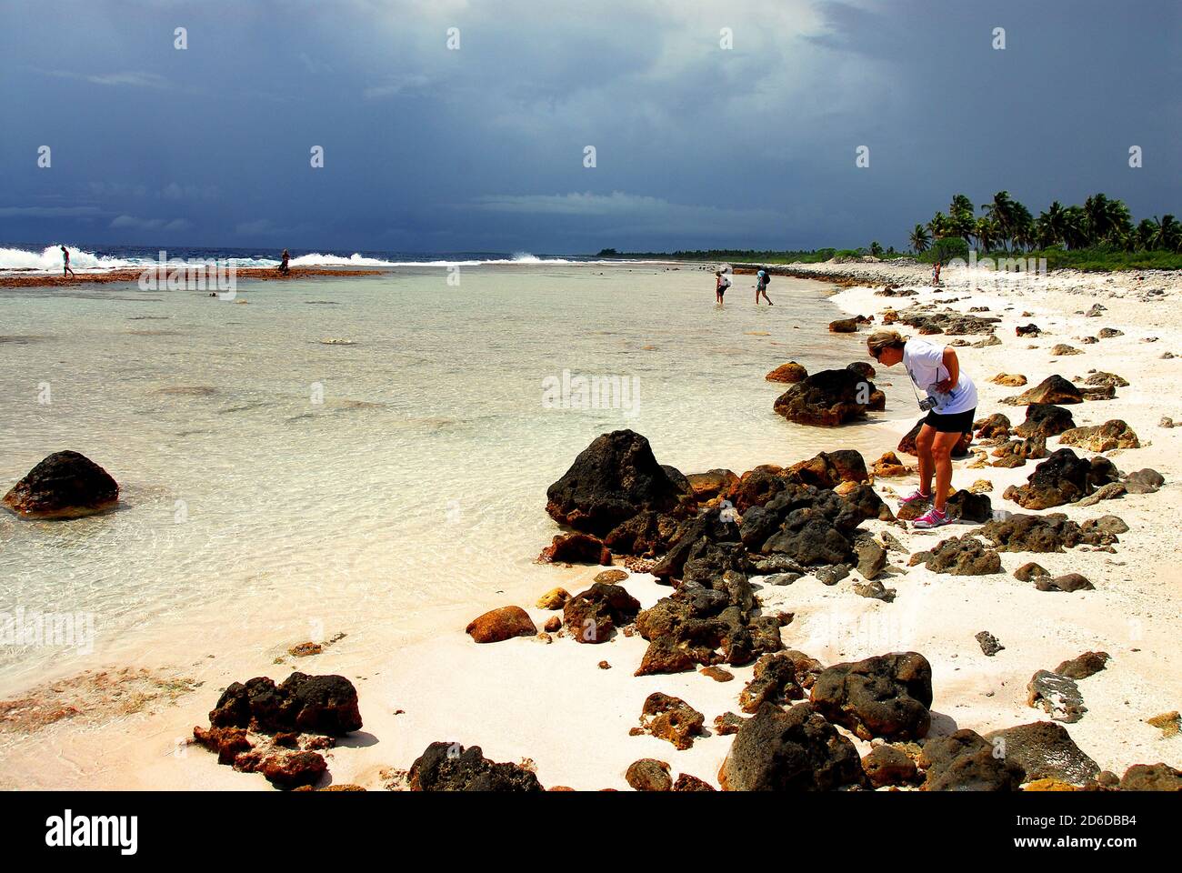 Windward beach, tourists exploring on beach Fakarava, Tuamotu Atolls ...