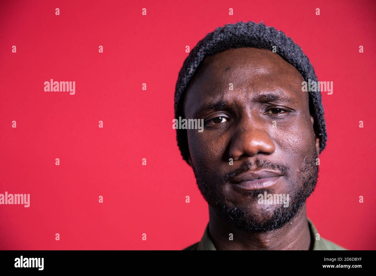 Young black man looking at camera with questioning facial expression ...