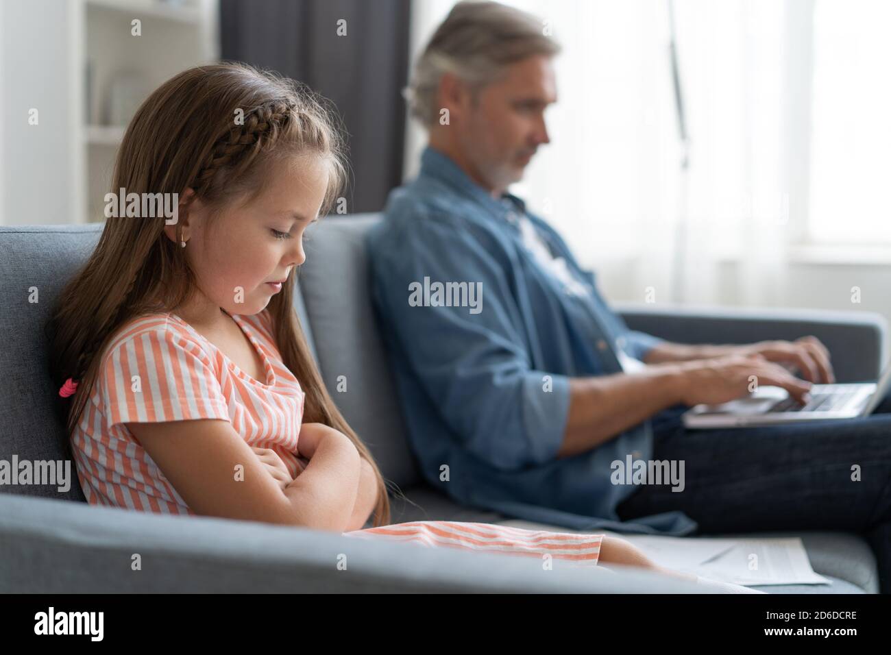 No Time For Child. Grey-haired dad busy with laptop, working online at ...
