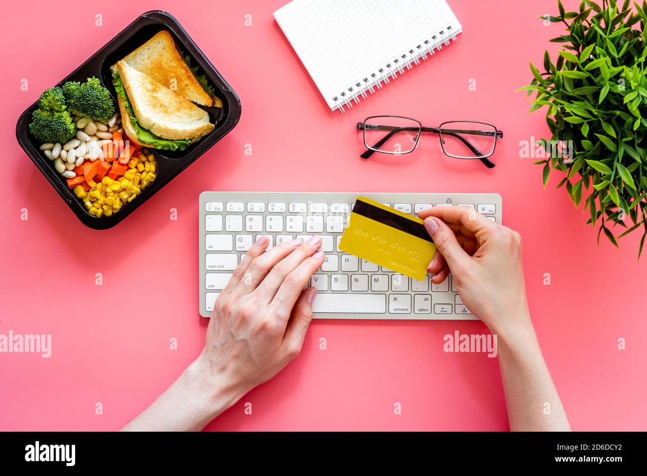 Woman using desktop app to order lunch with delivery Stock Photo - Alamy