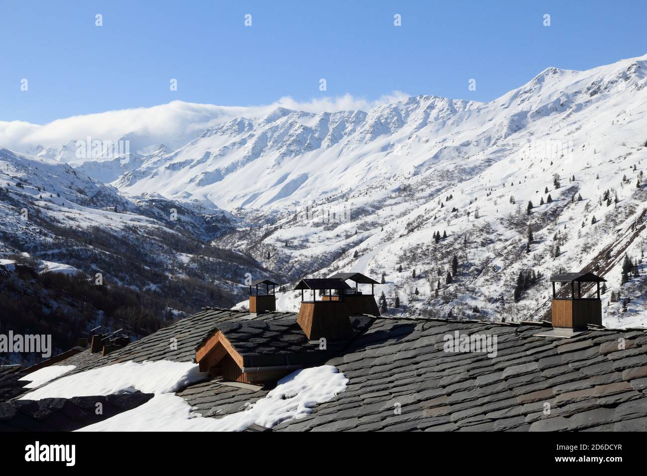 Snowy Alps of France over rooftops of Valmeinier. Valloire of Rhone ...