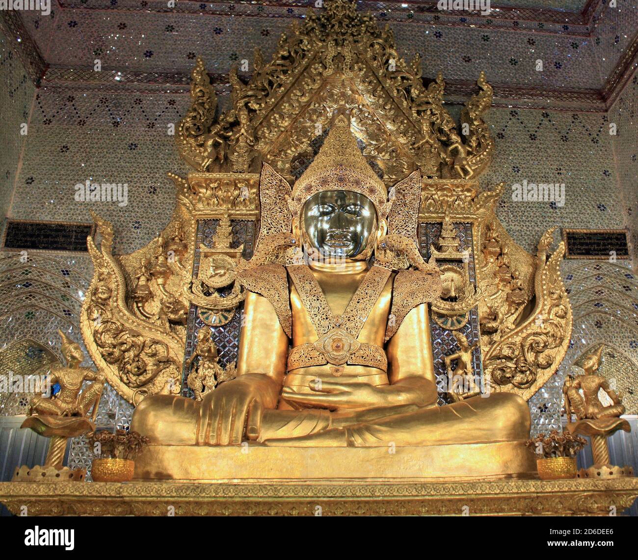 Beautiful gold colored Mahamuni Buddha statue in an ornate chamber in ...