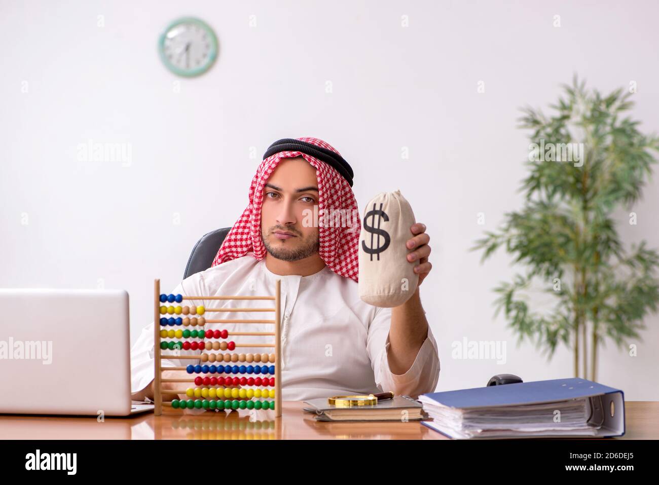 Male arab employee working in the office Stock Photo - Alamy
