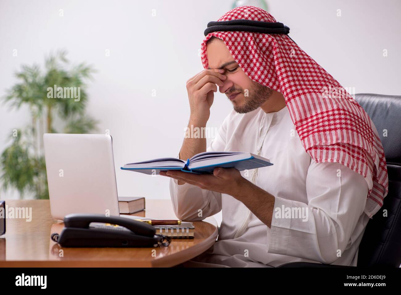 Male arab employee working in the office Stock Photo - Alamy
