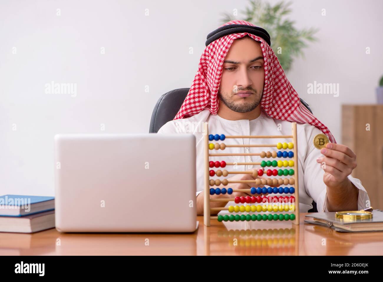 Male arab employee working in the office Stock Photo - Alamy