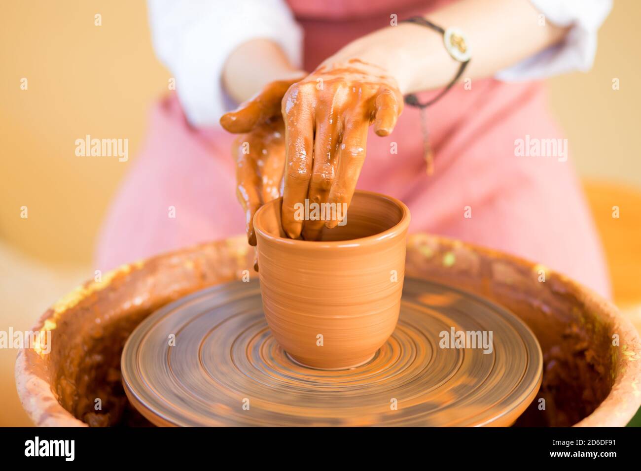 Woman modeling vessel wet clay hi-res stock photography and images - Alamy