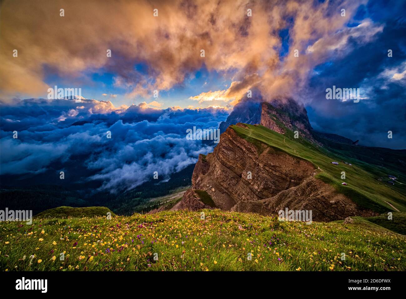 Fog and clouds surrounding the steep, rough cliffs and summits of the ...