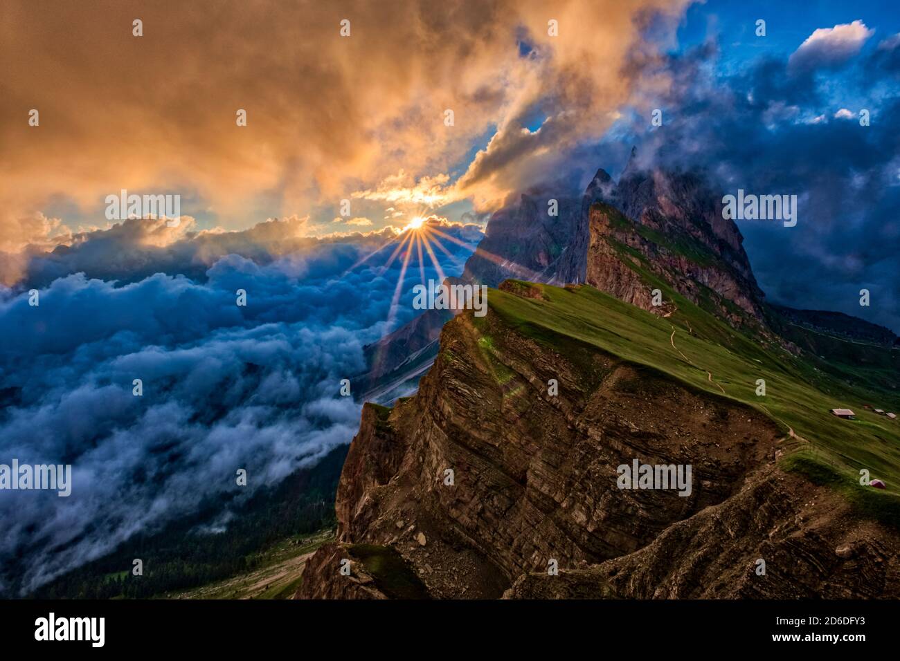 Fog and clouds surrounding the steep, rough cliffs and summits of the ...