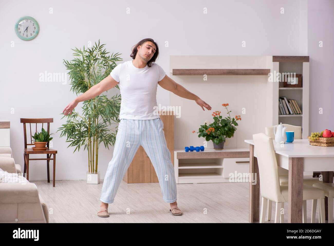 Man starting day with morning exercises Stock Photo - Alamy