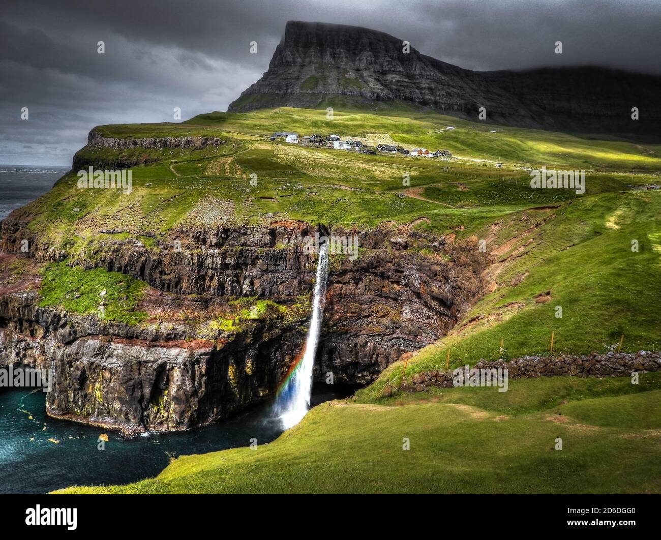 A View On Mulafossur Waterfall In Gasadalur Faroe Islands With Small