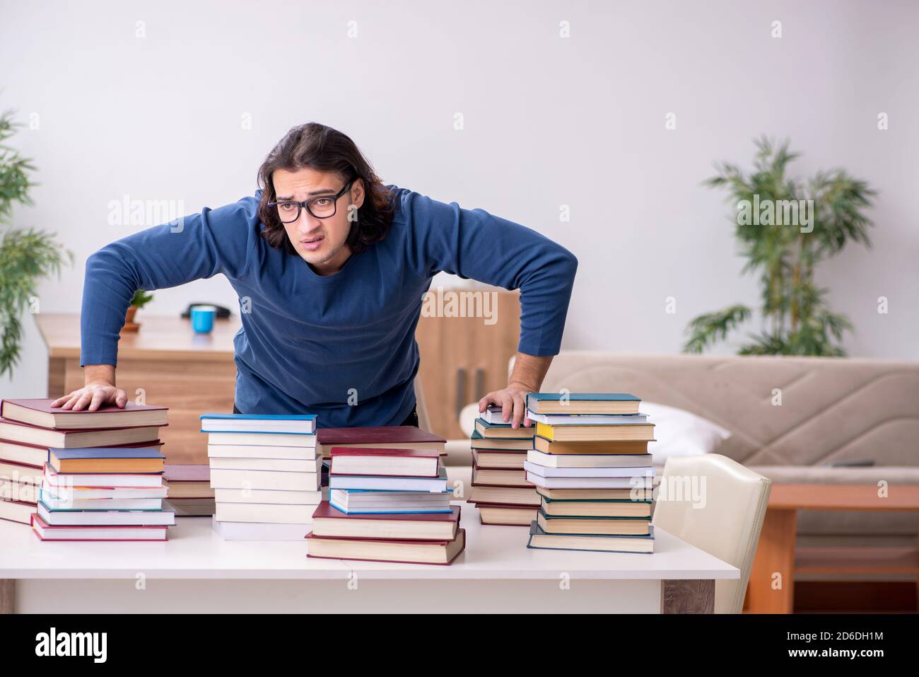 Young student preparing for exams at home Stock Photo - Alamy