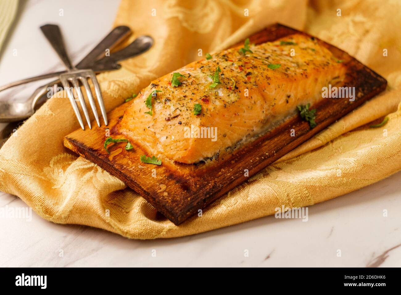Fresh grilled salmon seasoned with citrus and herb rub served on cedar ...