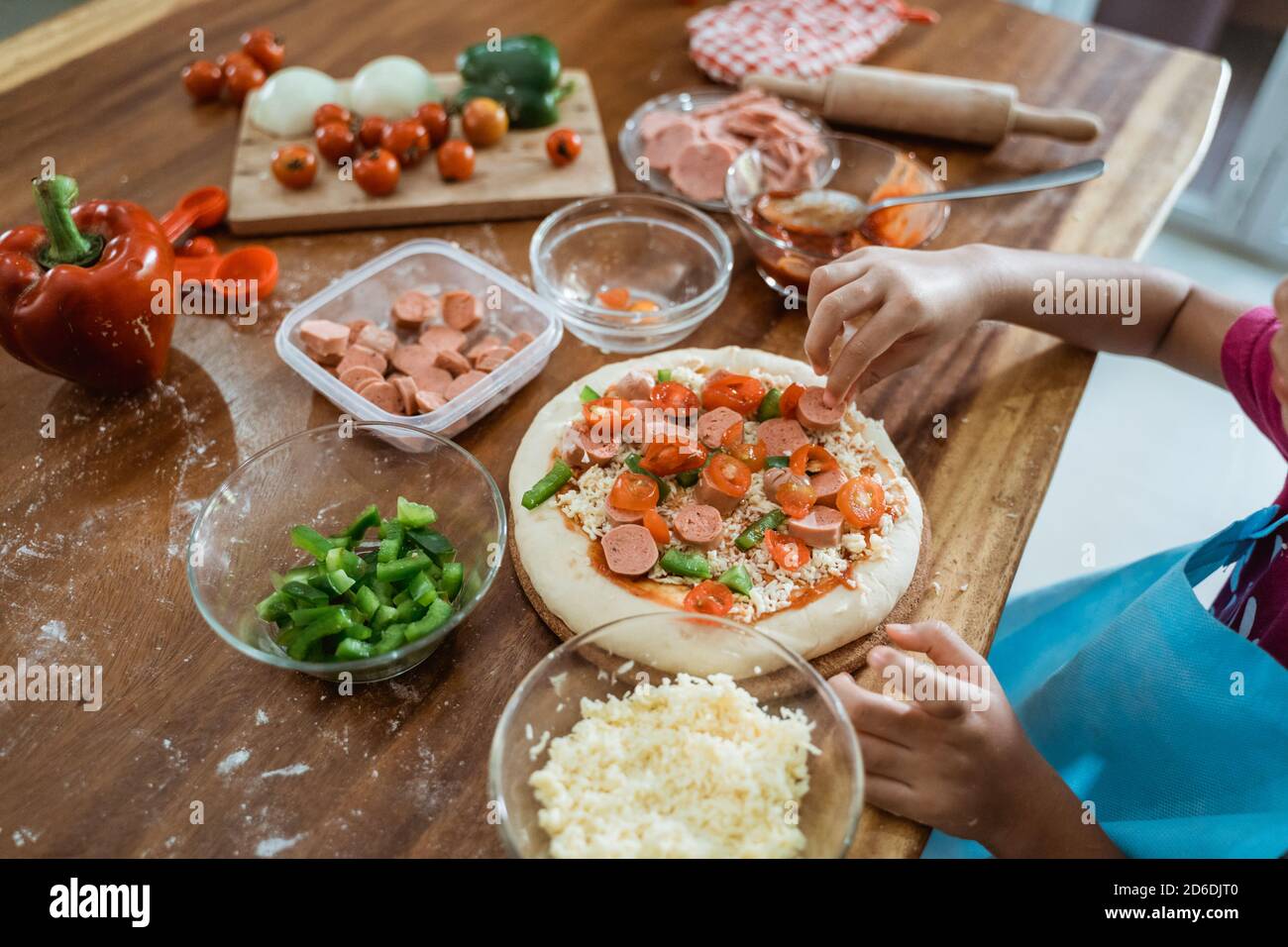 Photo of children hands cooking Italian food at home Stock Photo - Alamy