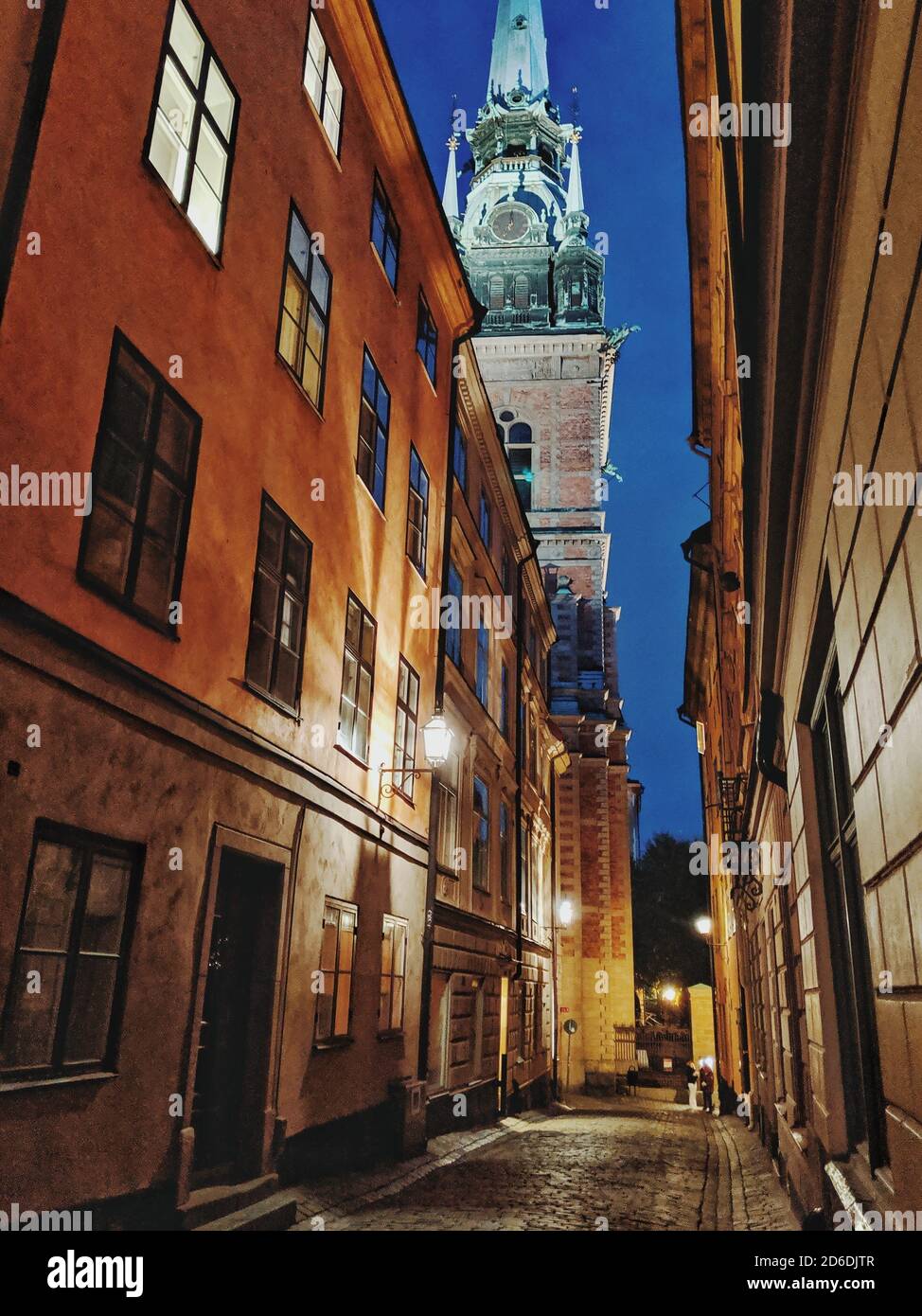 Stockholm, Sweden, alley on Gamla Stan, tower of Tyska kyrkan (German ...