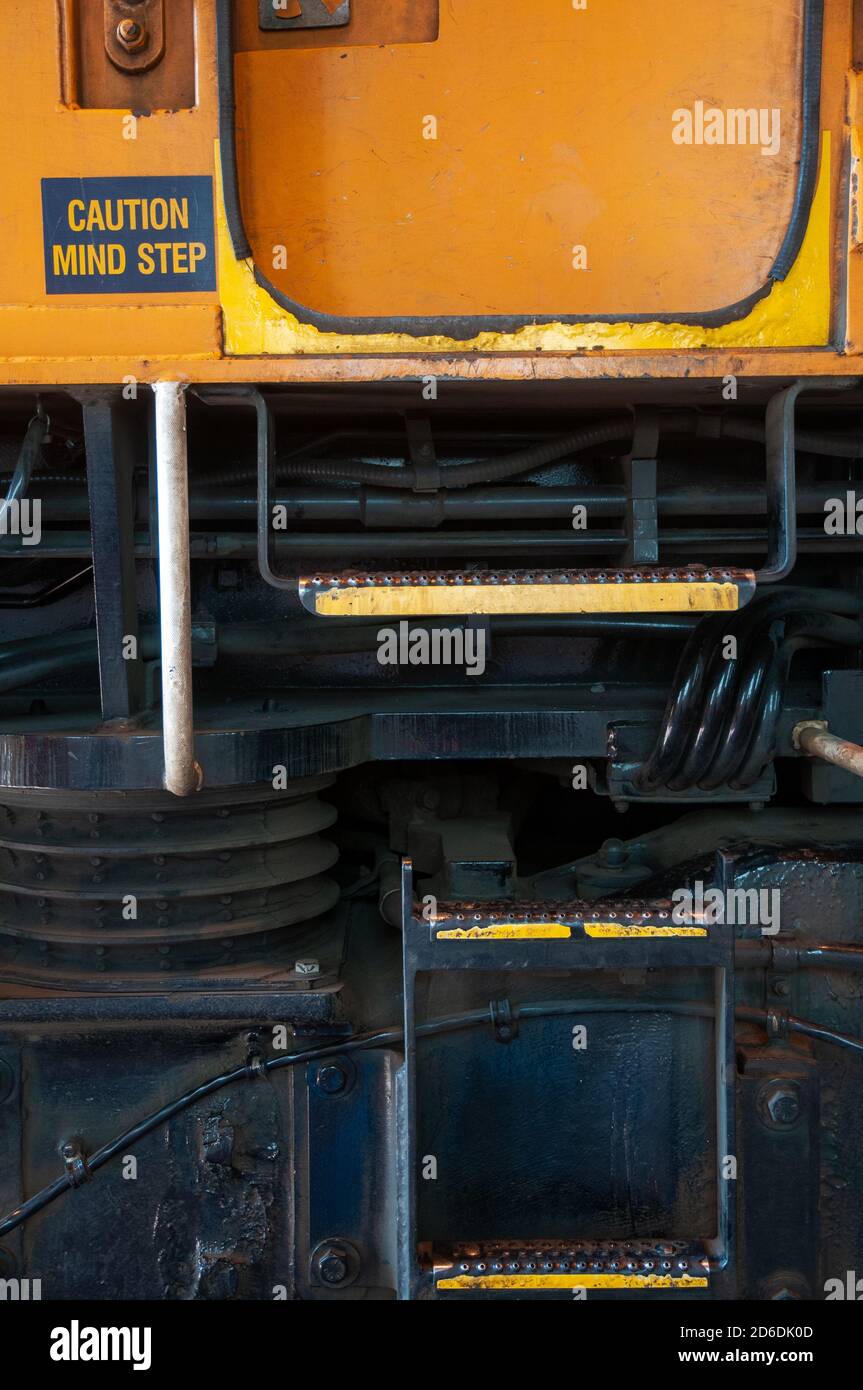 "Caution Mind Step". Detail of step ladder and door to driver's cabin ...