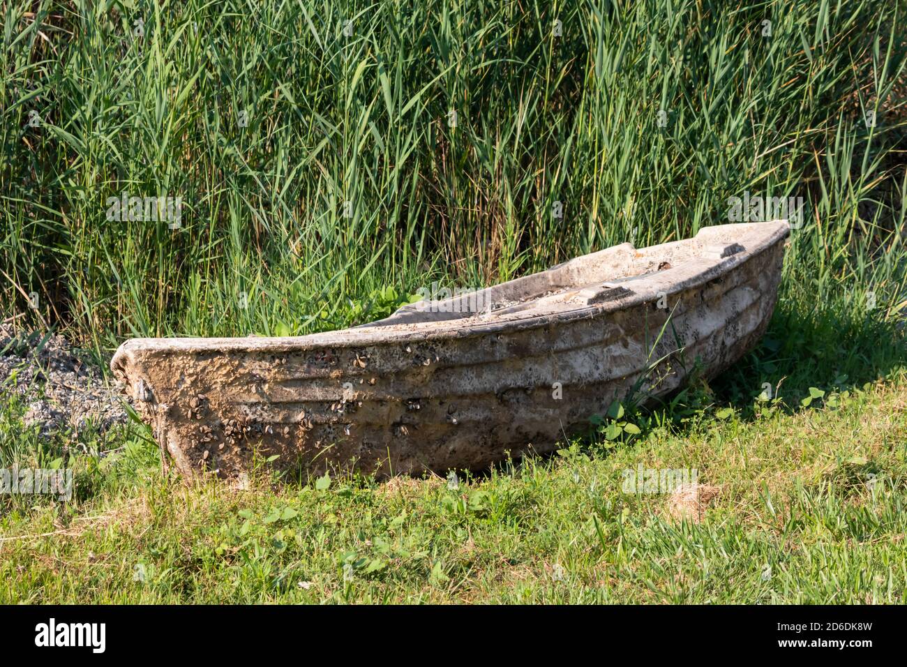 Old white boat out on the grass Stock Photo - Alamy