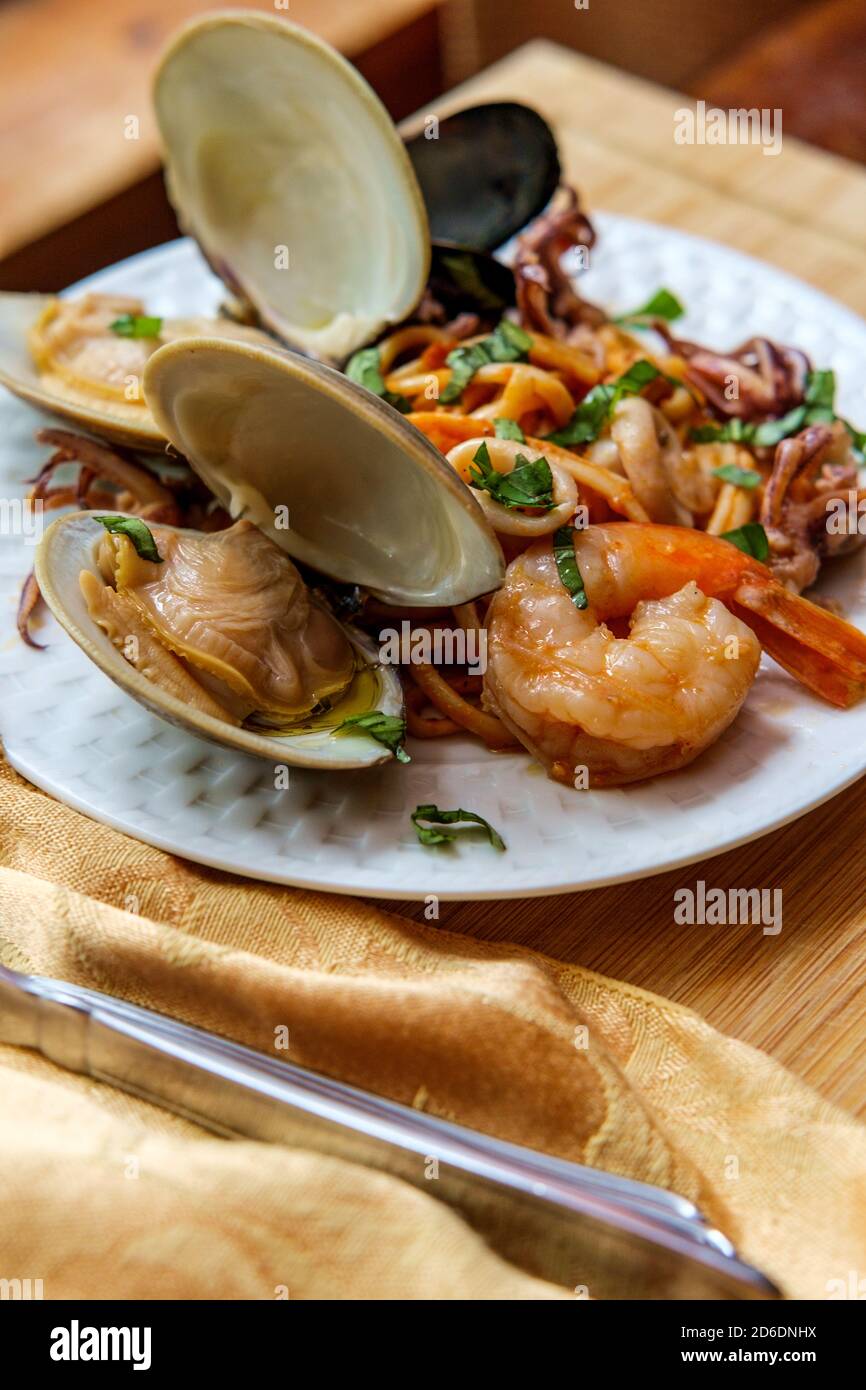 Italian seafood pasta pescatore with clams mussels and squid Stock ...
