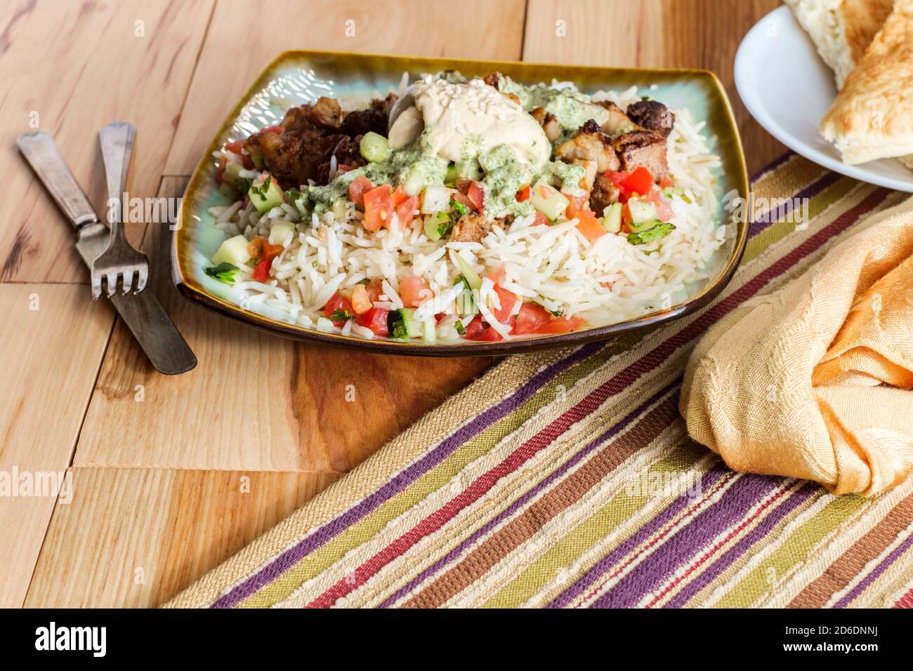 Authentic Middle Eastern chicken Shawarma rice platter with hummus and ...