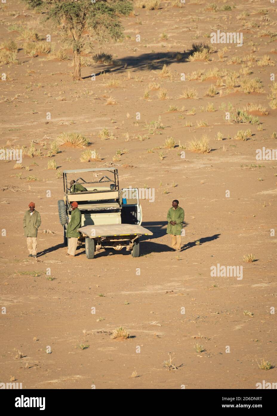 A hot air balloon ride in Namibia. Ground staff are waiting on site to ...