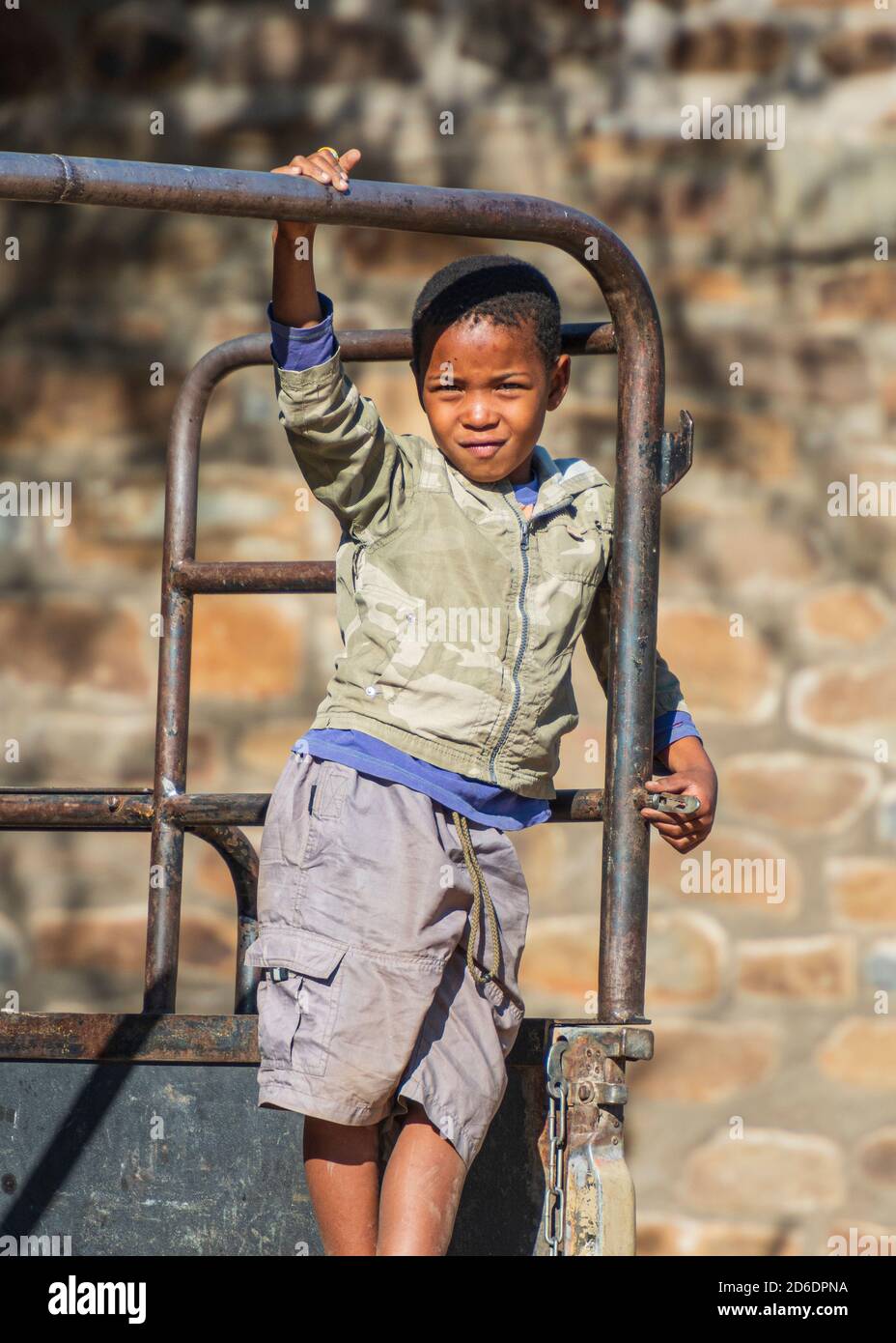 A jeep tour through Namibia, wildlife, country and people. African boy ...