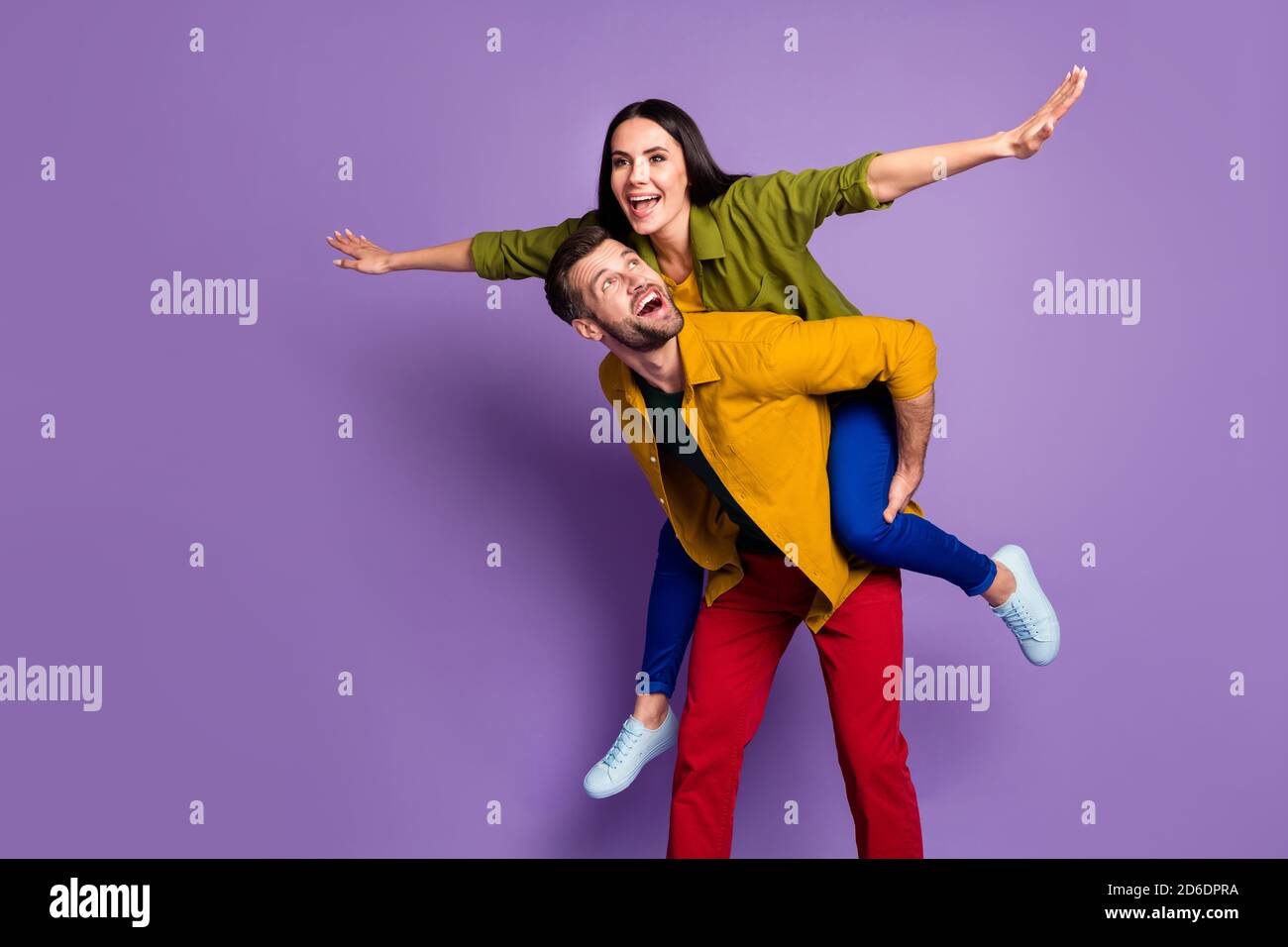 Photo pretty funny lady handsome guy couple carry piggyback meet ...