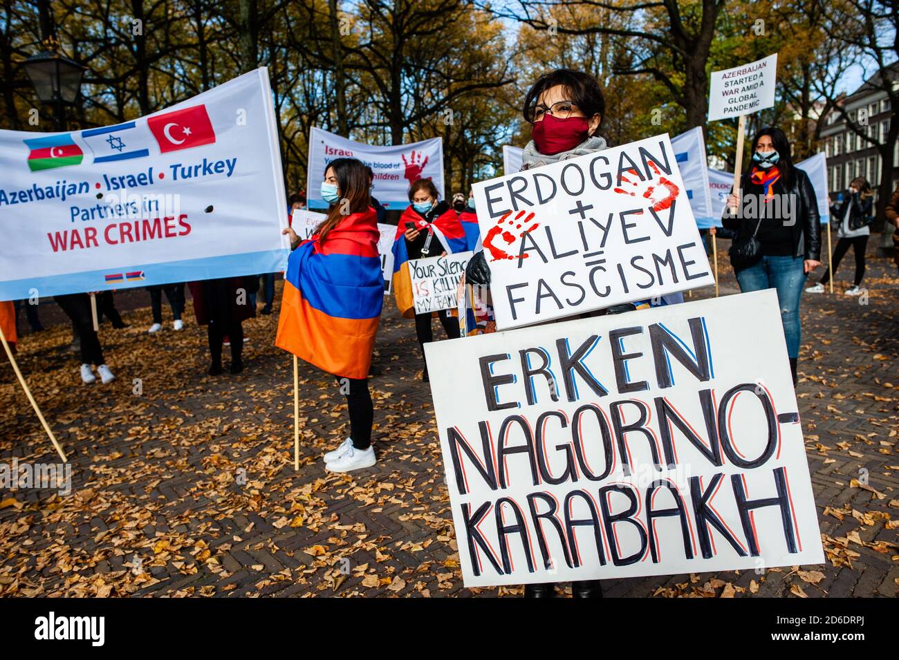 A protester holds placards against Erdogan during the demonstration ...