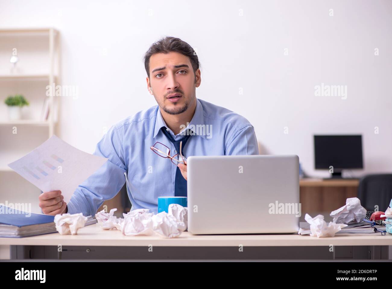 Sick male employee suffering at the workplace Stock Photo - Alamy