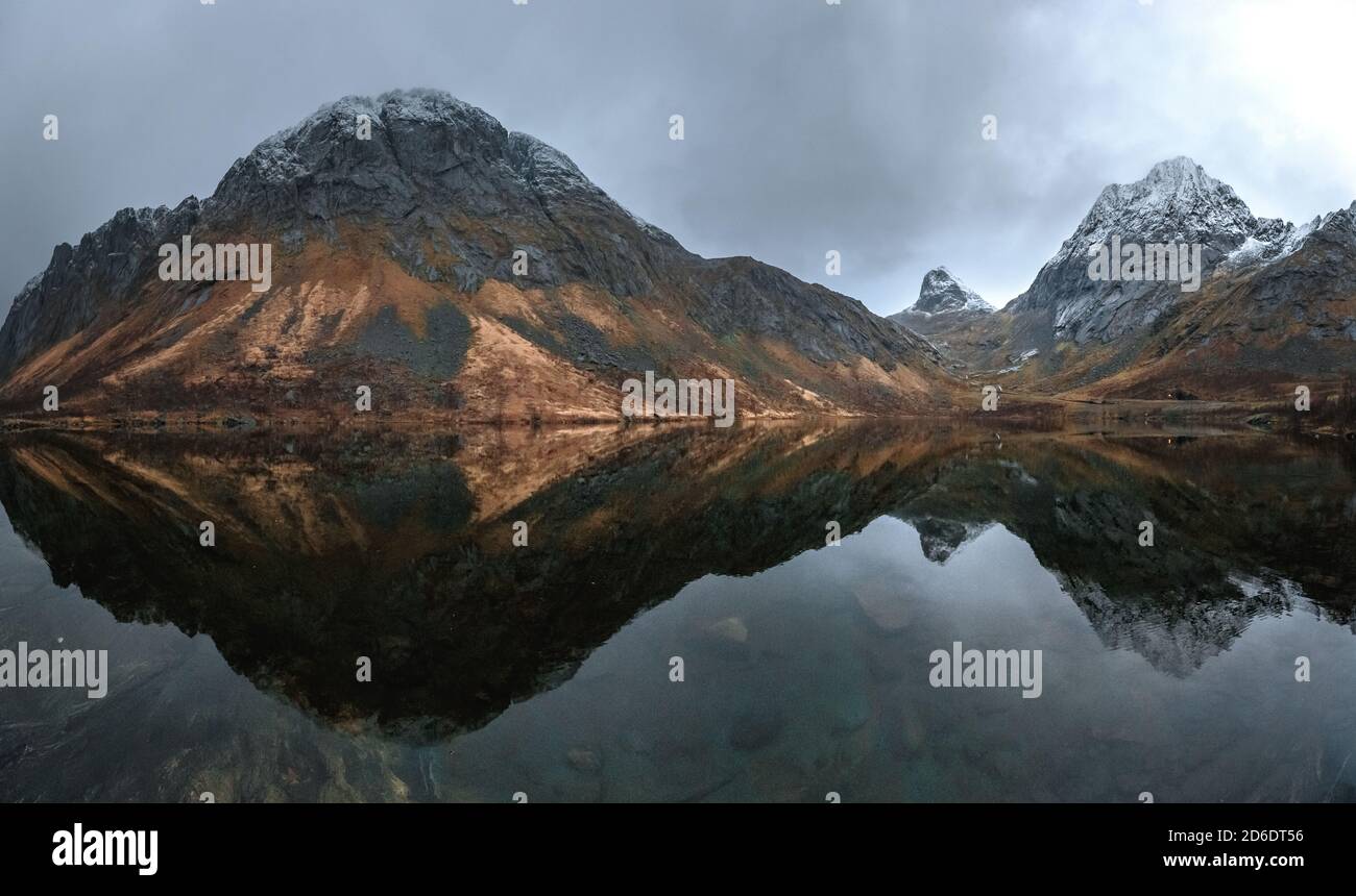 Atmospheric reflection in a small lake in the fjords of Senja, Norway ...
