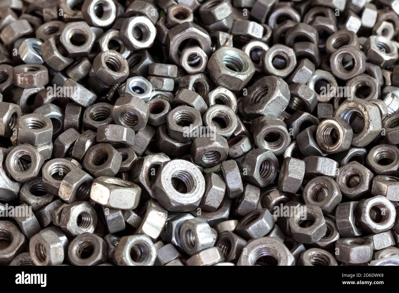 Rusty steel nuts of various sizes Stock Photo - Alamy